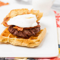 The Breakfast Burger: A waffle bun with crispy bacon, a poached egg and ...
